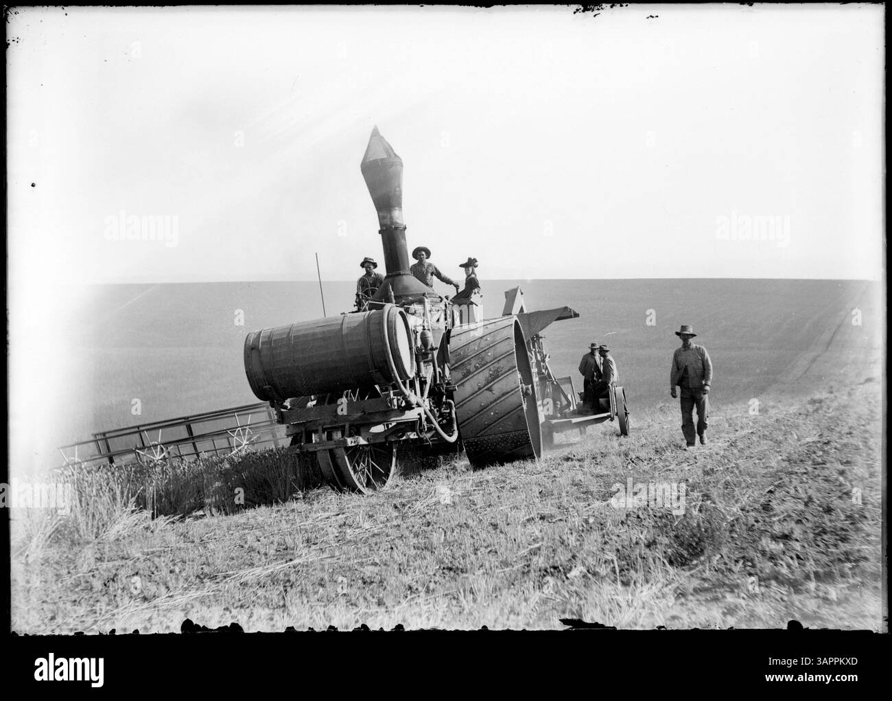 Photograph of a steam tractor pulling a combine, taken by Lee Moorhouse ...