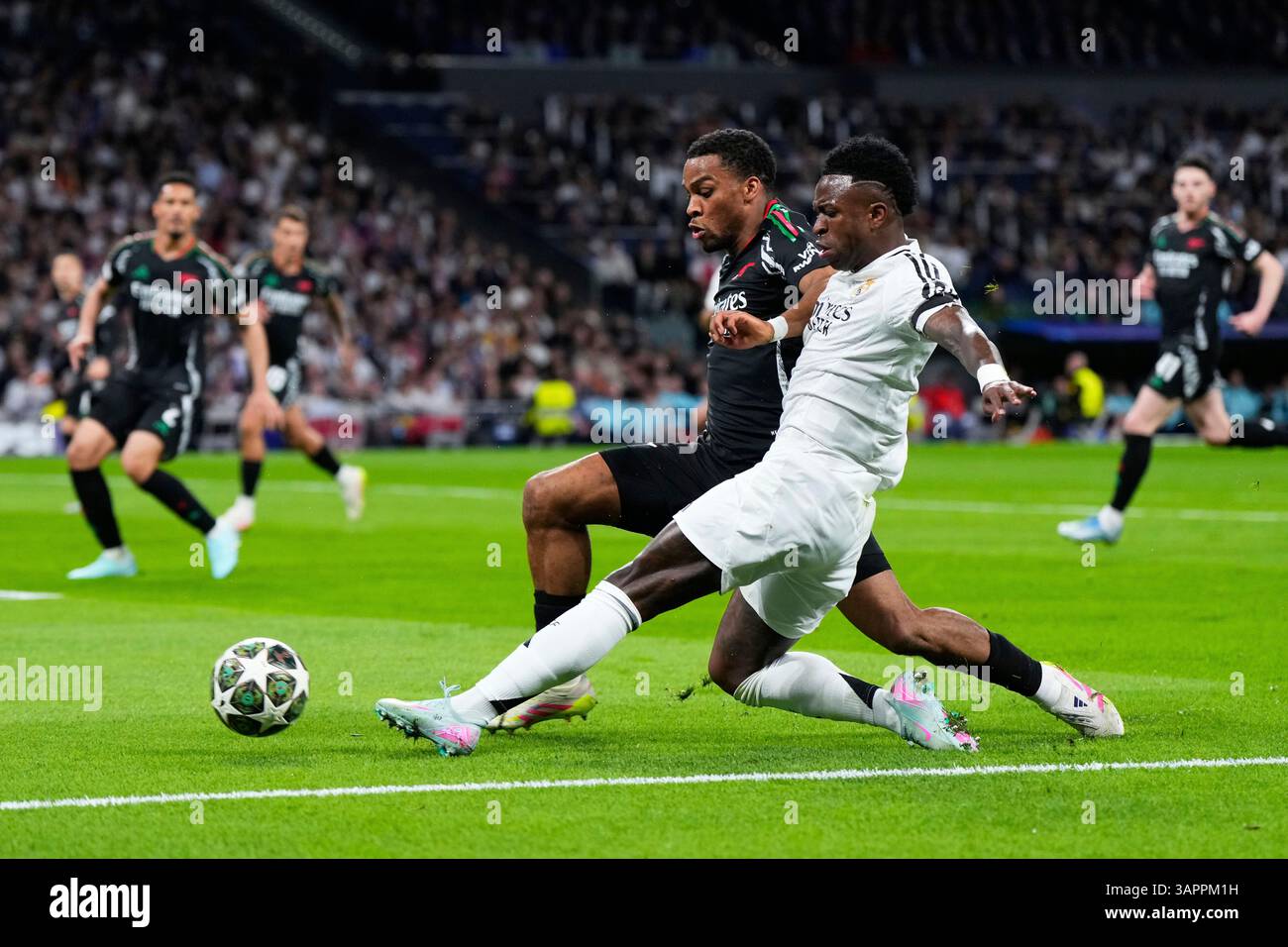Arsenal's Jurrien Timber vies for the ball with Real Madrid's Vinicius ...