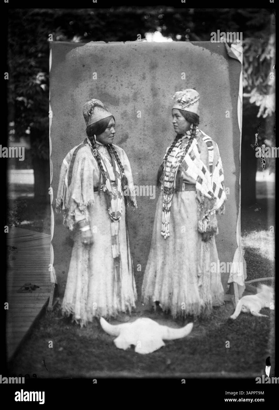This photograph depicts tribal women dressed in various regalia ...