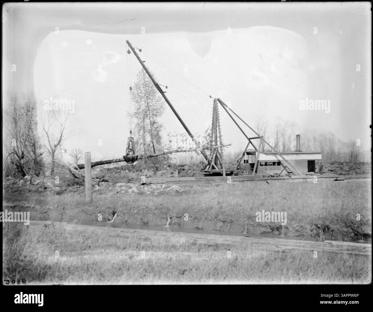 This photograph shows the Columbia Digger Co. No. 1 dredger dredging a ...