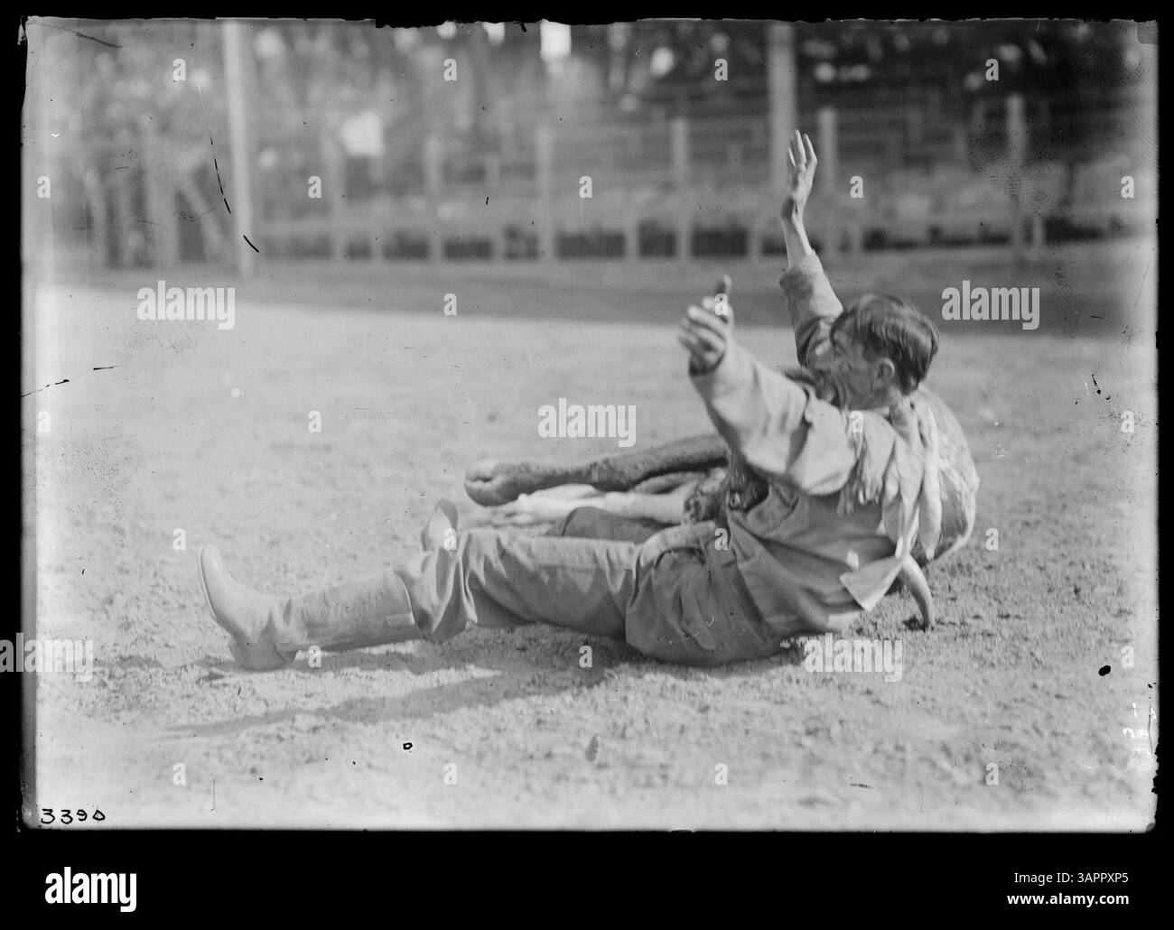 This Lee Moorhouse photograph captures Glenn Bushee bulldogging ...