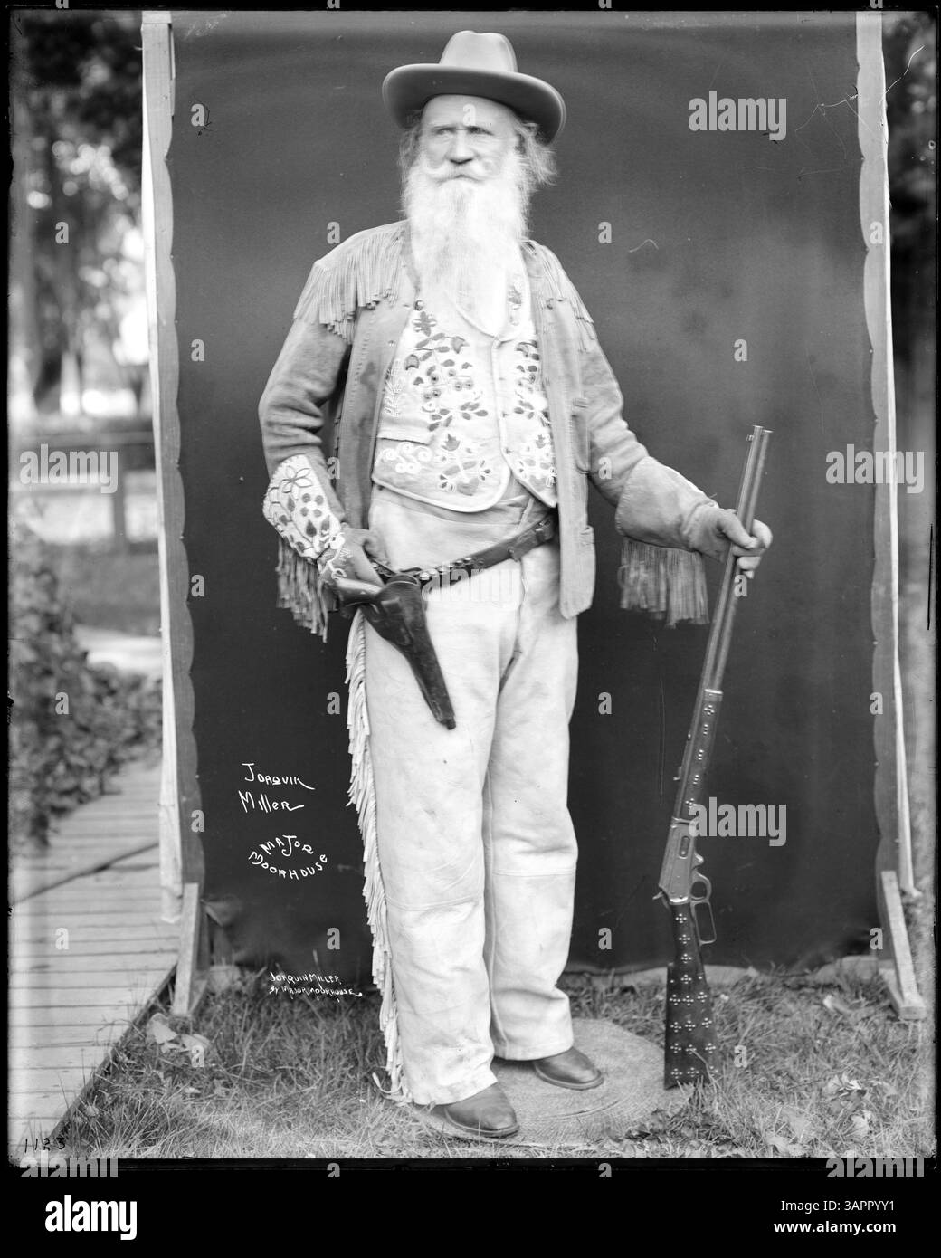 This photograph shows Joaquin Miller in frontier costume, holding a ...