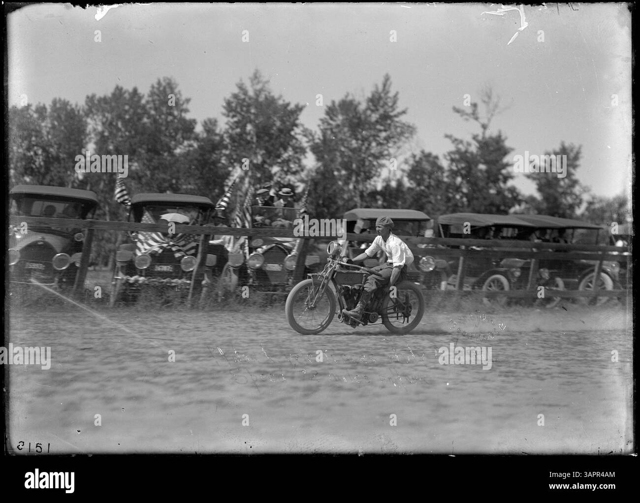 Photograph by Lee Moorhouse capturing a motorcycle race on a track ...