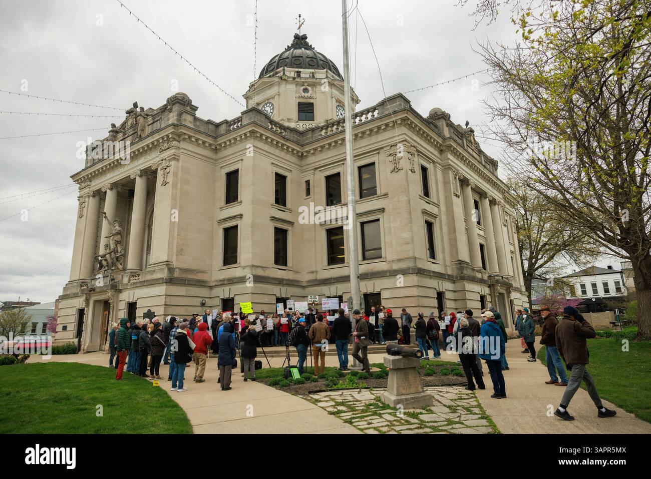 Protesters rally outside the Monroe County Courthouse ahead of a visit ...