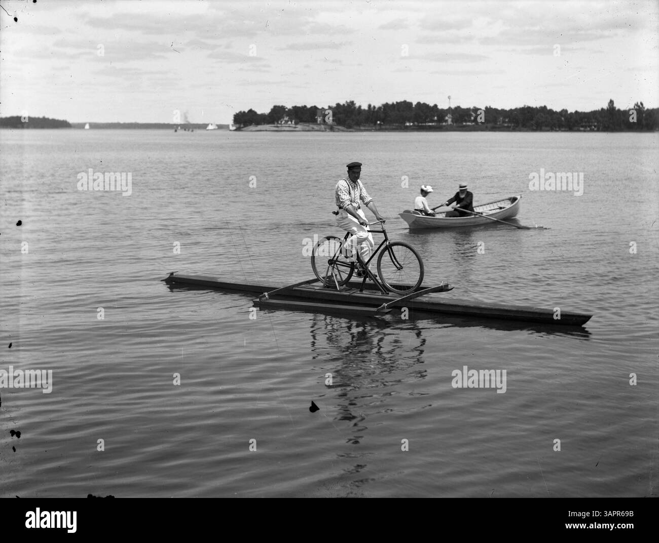 Mr. Petterson of Excelsior is seen riding his unique water bicycle on ...