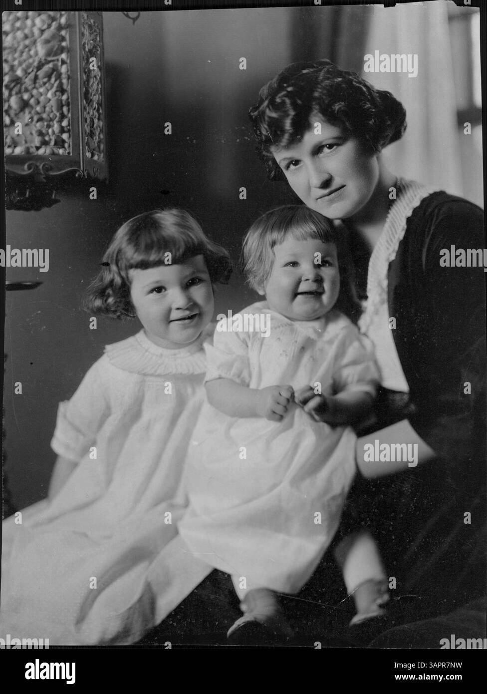 This photograph features Mrs. Legg with her two daughters, capturing a ...