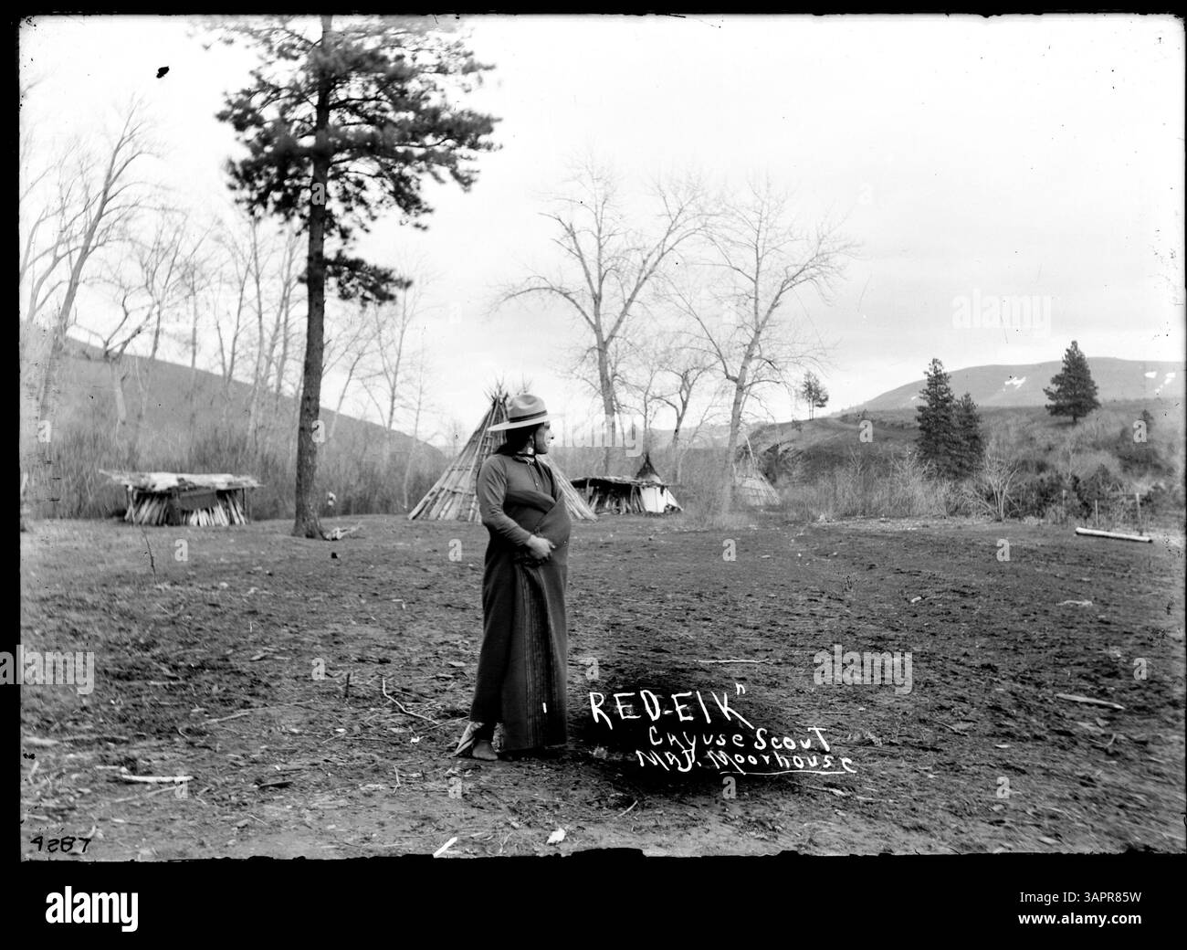 Photograph by Lee Moorhouse showing Red Elk, a Cayuse Indian, standing ...