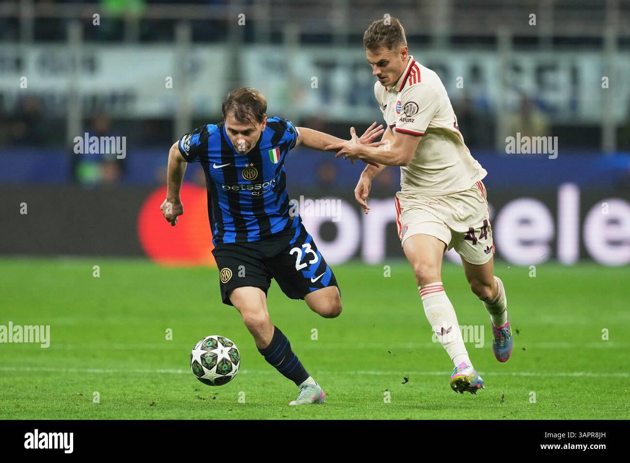 Inter Milan's Nicolo Barella, left, challenges for the ball with Bayern ...