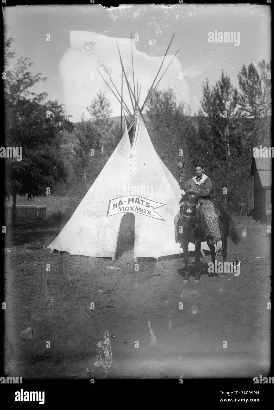 A man on horseback next to a tipi on the Umatilla Indian Reservation ...