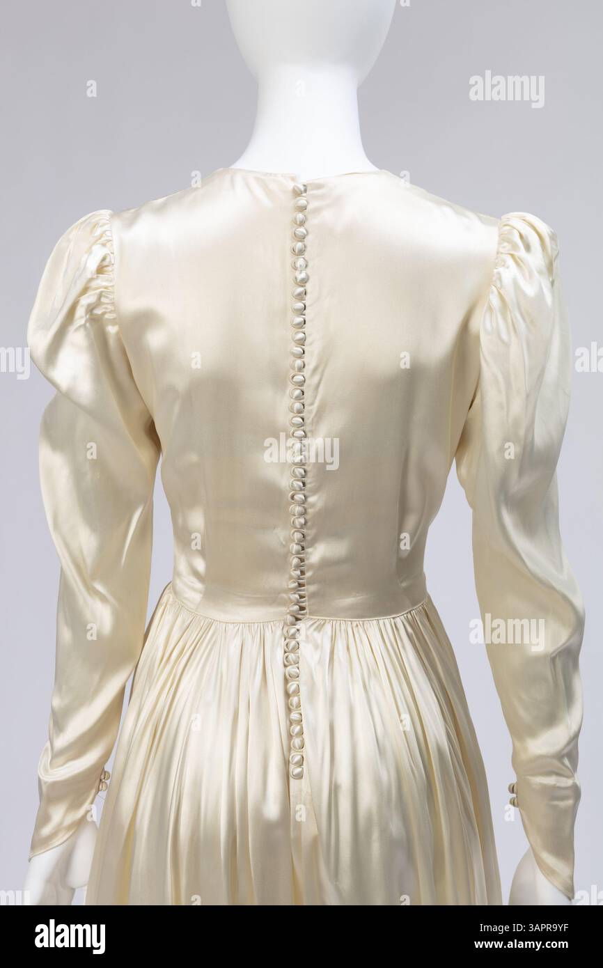 The ivory rayon satin wedding dress and tulle veil worn by Mildred ...