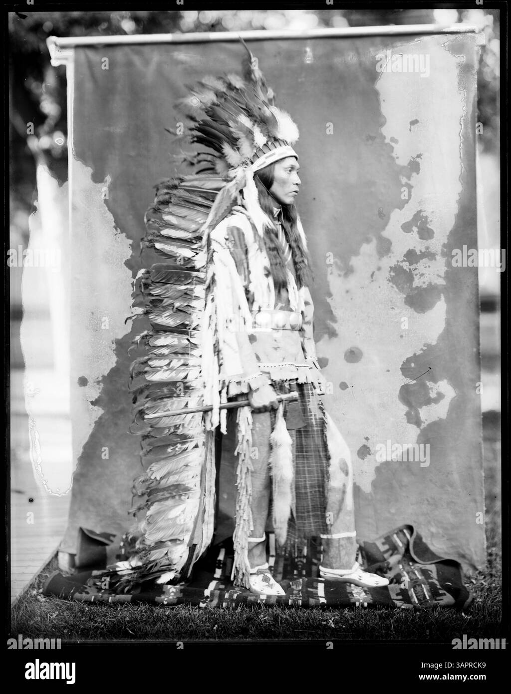 A portrait of a tribal man dressed in full regalia, captured by Lee ...