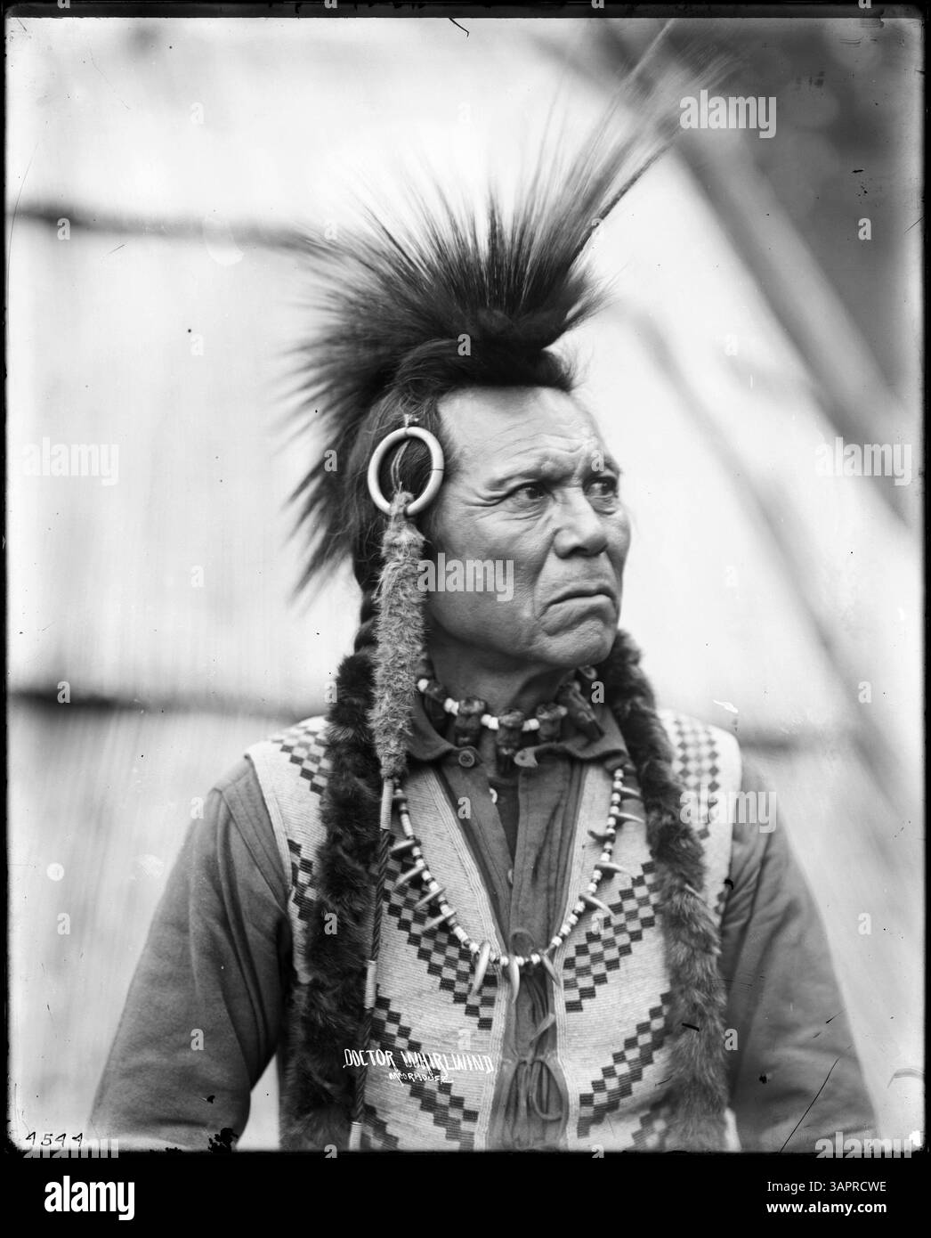This portrait photograph features a Cayuse tribal man in traditional ...