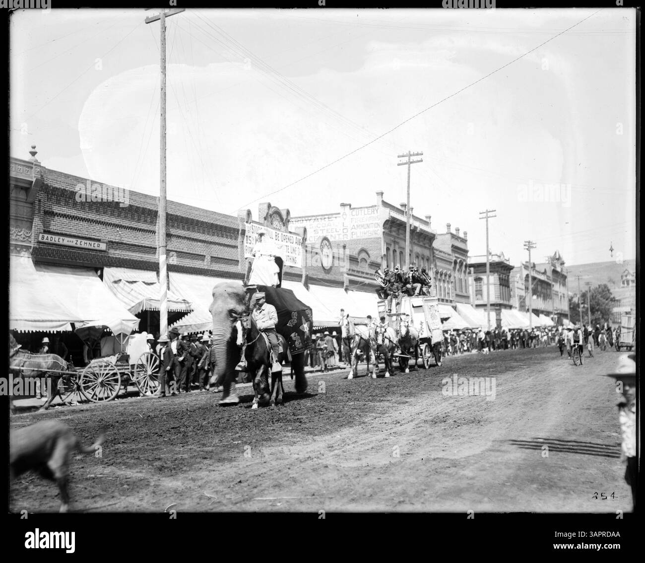 This photograph by Lee Moorhouse depicts a circus parade from the Sells ...