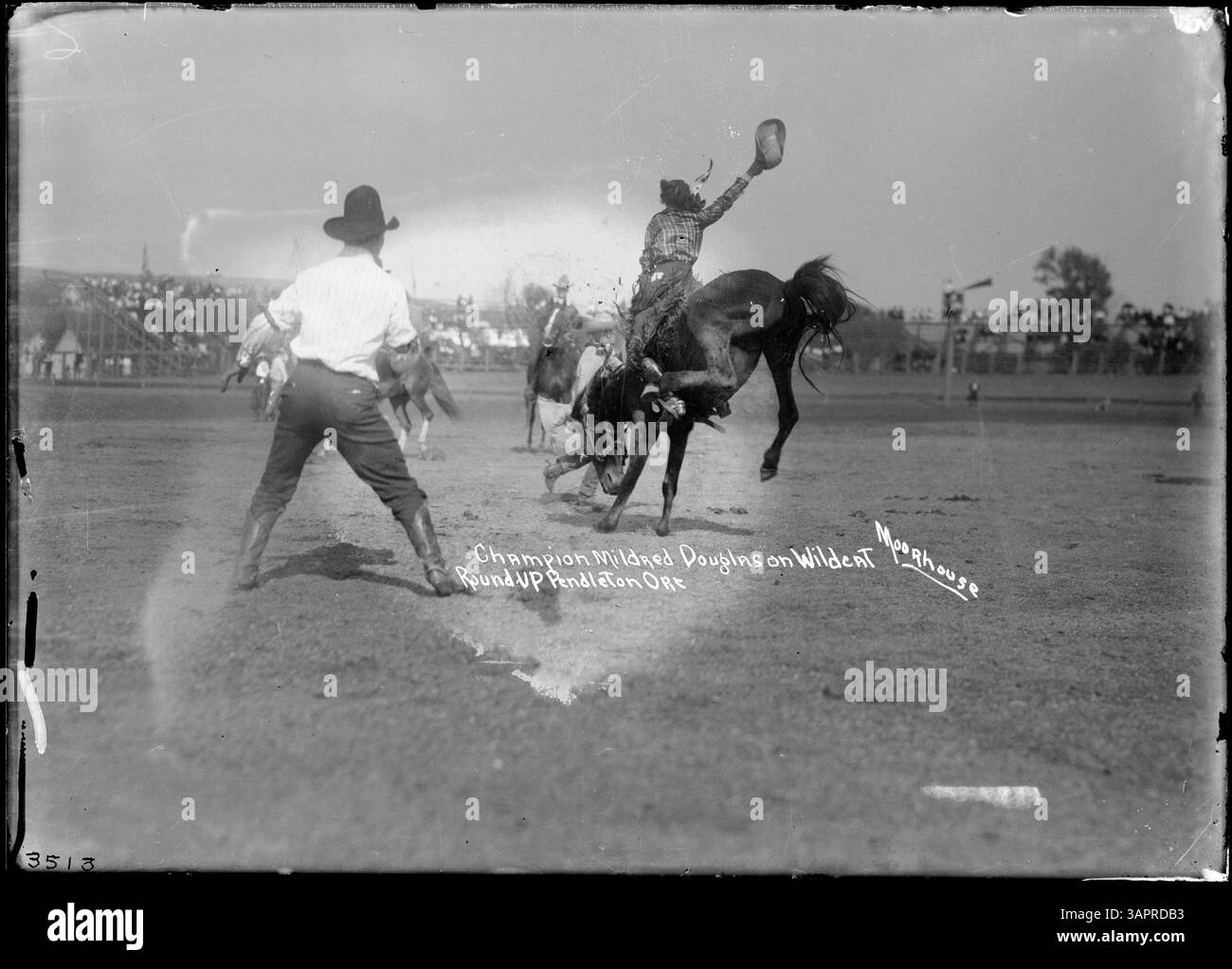 This photograph by Lee Moorhouse features Mildred Douglas on bucking ...