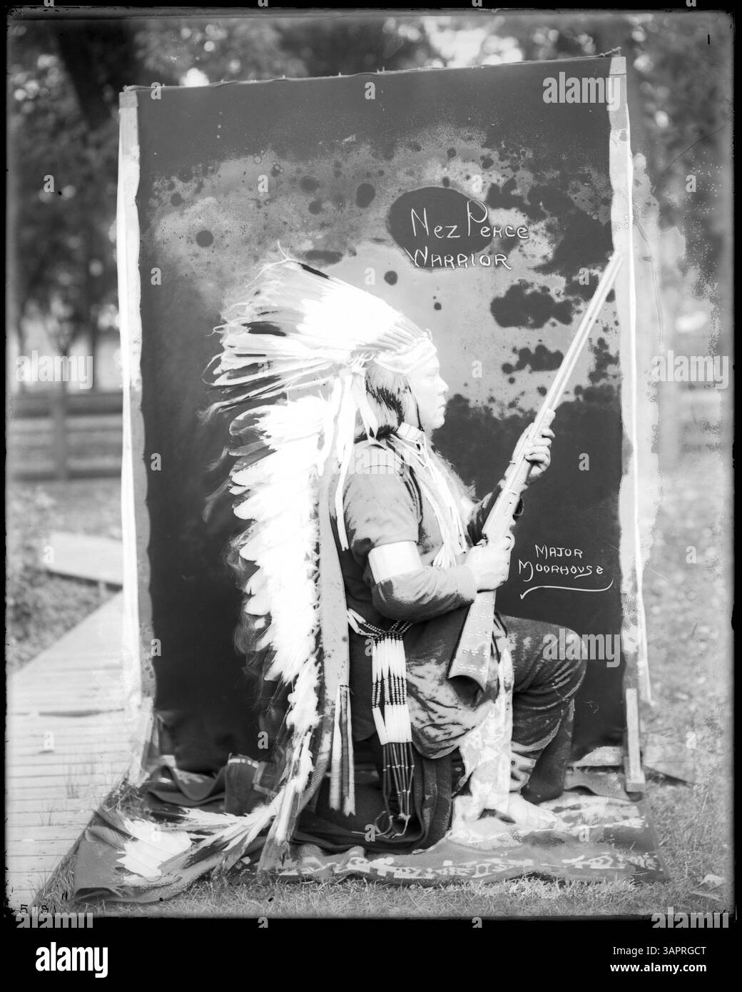 This photograph by Lee Moorhouse features a Nez Perce Indian wearing a ...
