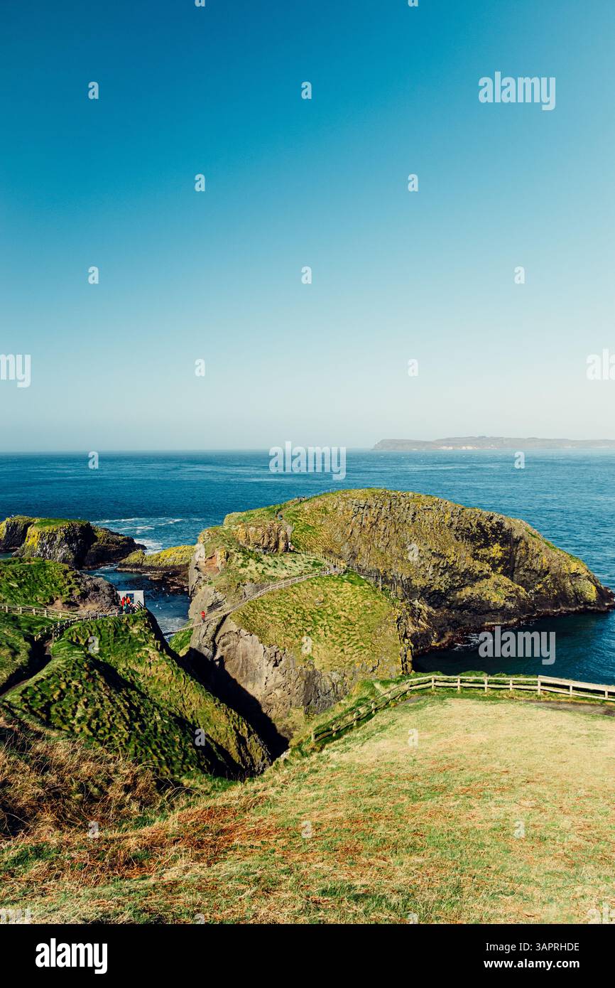 Visitors cross the Carrick-a-Rede Rope Bridge in County Antrim ...