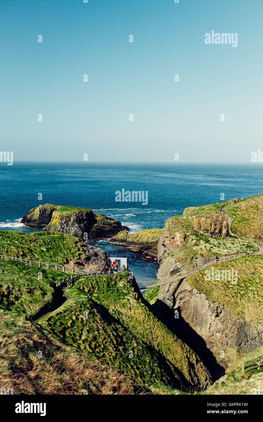 Visitors cross the Carrick-a-Rede Rope Bridge in County Antrim ...