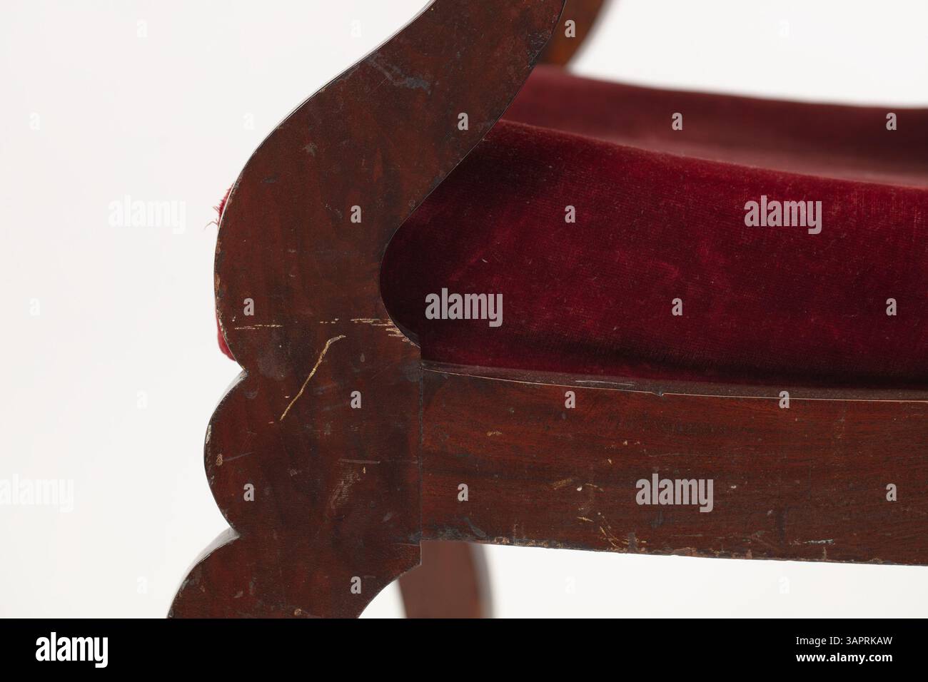 High-backed priest's chair with a red velvet upholstered seat and back ...