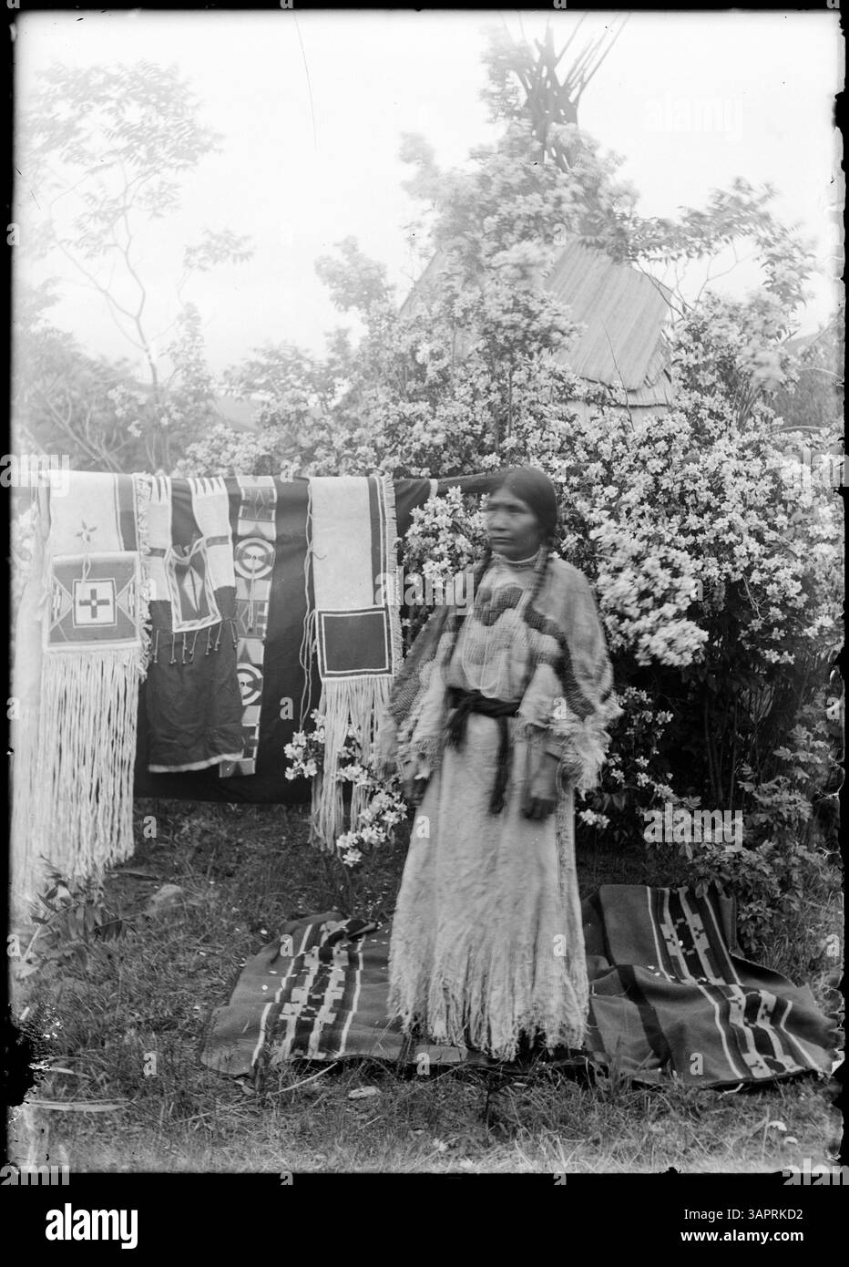 Photograph by Lee Moorhouse of a tribal woman weaving tapestries. The ...