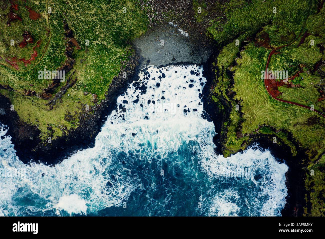 Top-Down Drone Shot of Hidden Rocky Beach and Crashing Blue Waves at ...