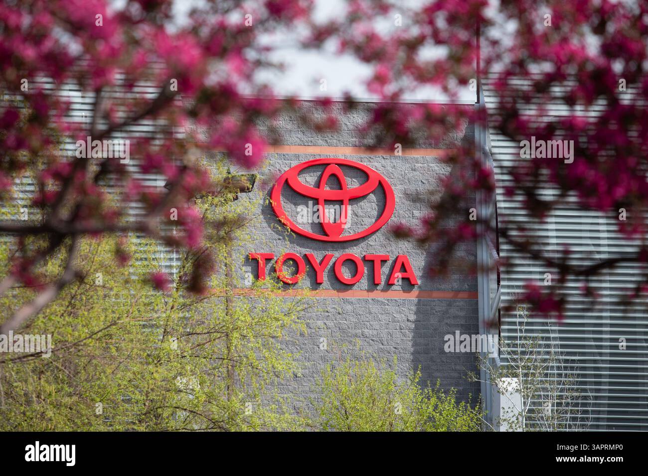 Toyota logo on the outside of a showroom. Tariffs imposed by the Trump ...