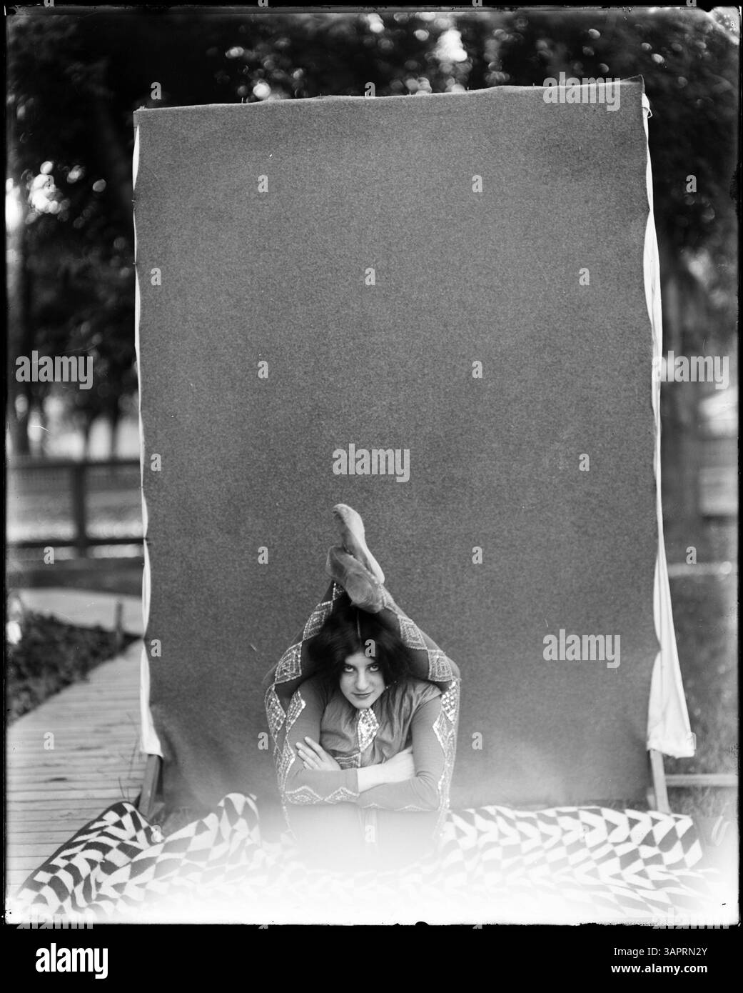 This Lee Moorhouse photograph features a contortionist, showcasing a ...