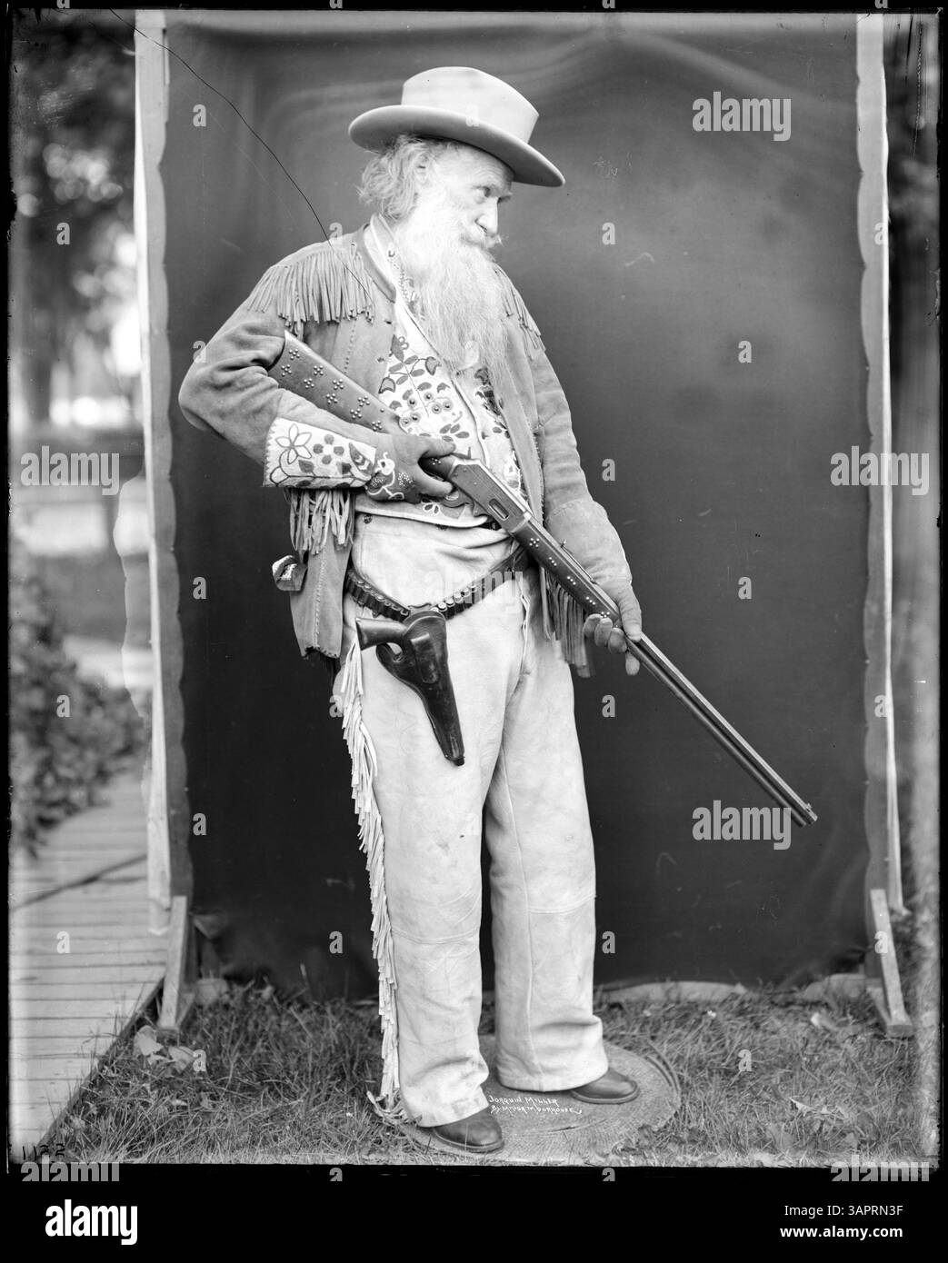 This full-length photograph shows Joaquin Miller in frontier costume ...