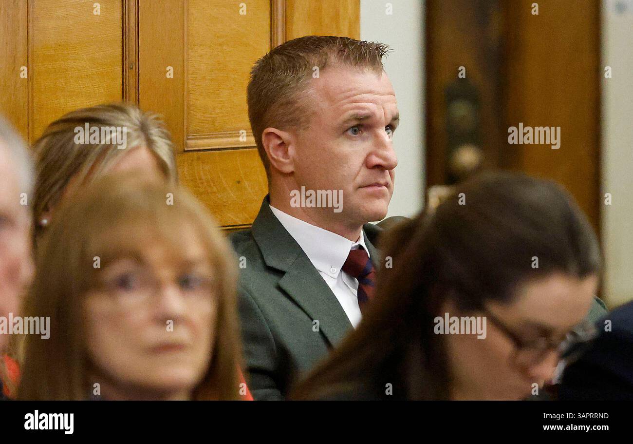 Blogger Aidan Kearney sits in the back of the courtroom as his lawyer ...