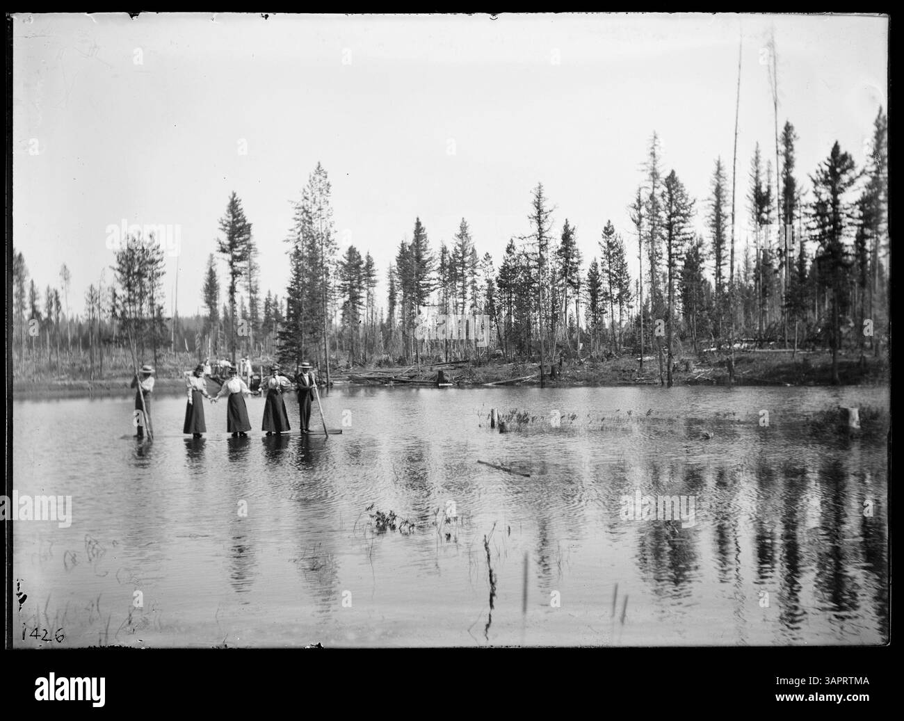 This photograph, taken by Lee Moorhouse, depicts a picnic party at ...