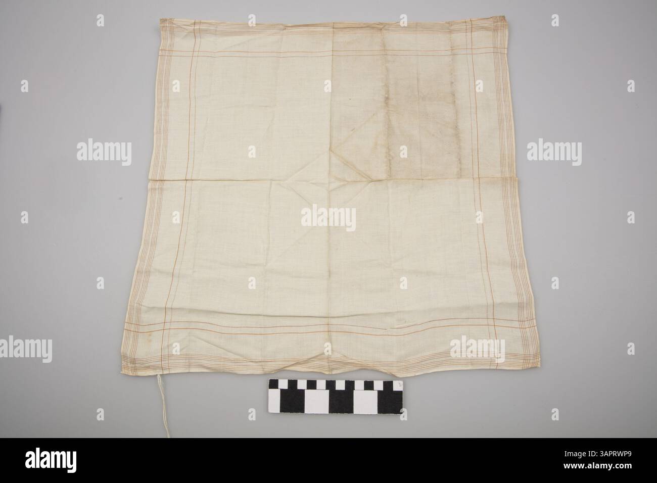 This off-white linen handkerchief with brown stripes was packed by ...