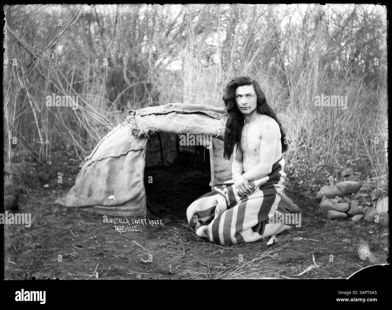 This photograph by Lee Moorhouse depicts an Umatilla sweat house, with ...
