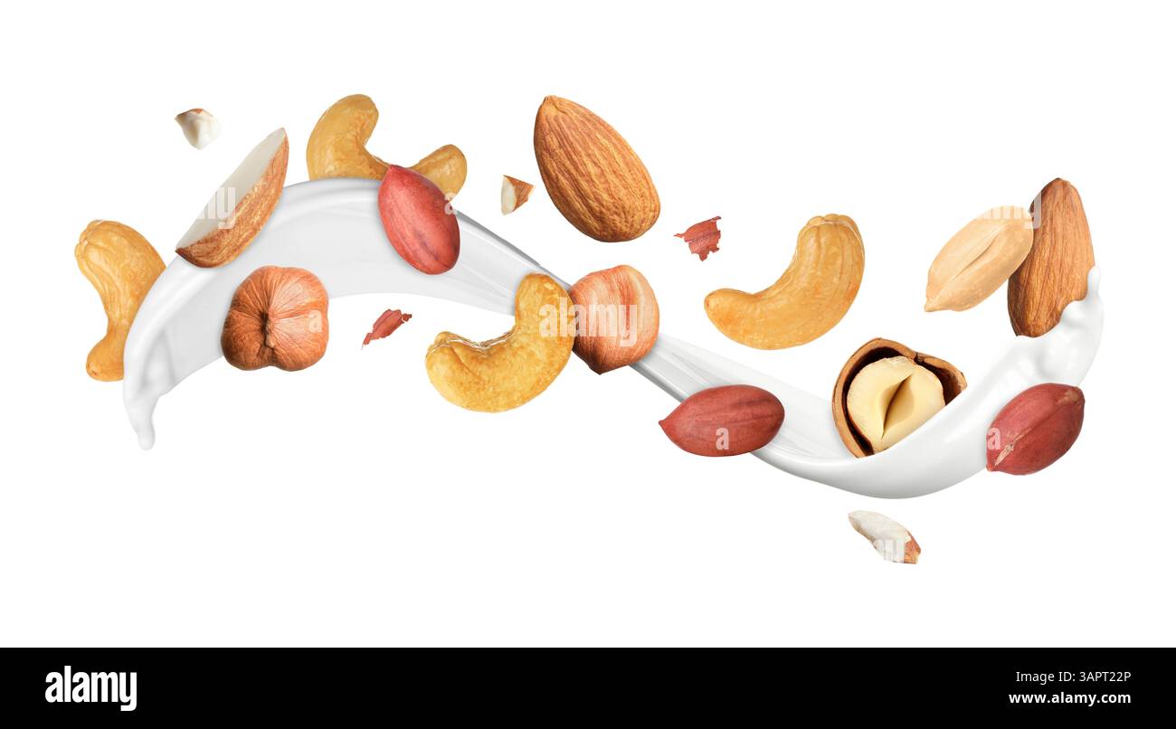 Milk splash with different nuts in air on white background Stock Photo ...