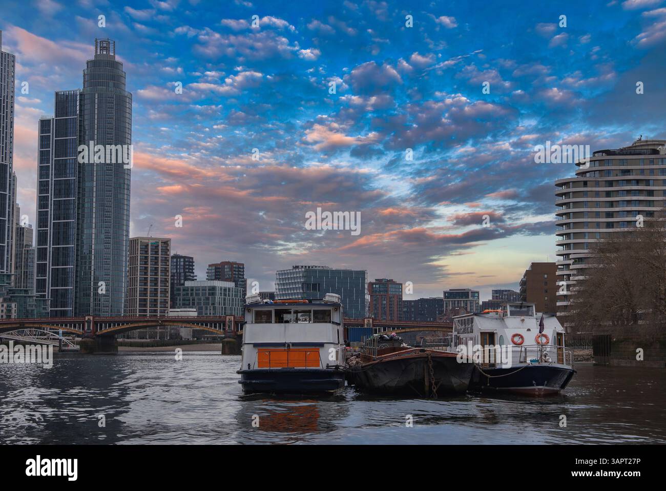 Riverside Scene in London with Boats, Skyscrapers, and Bridge Stock ...