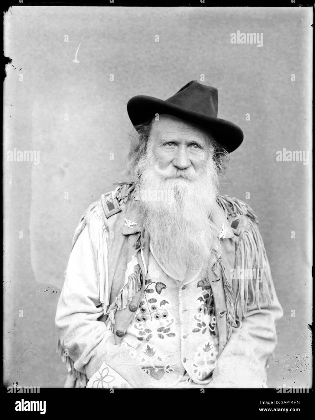 Photo of Joaquin Miller in frontier costume, holding a rifle, captured ...