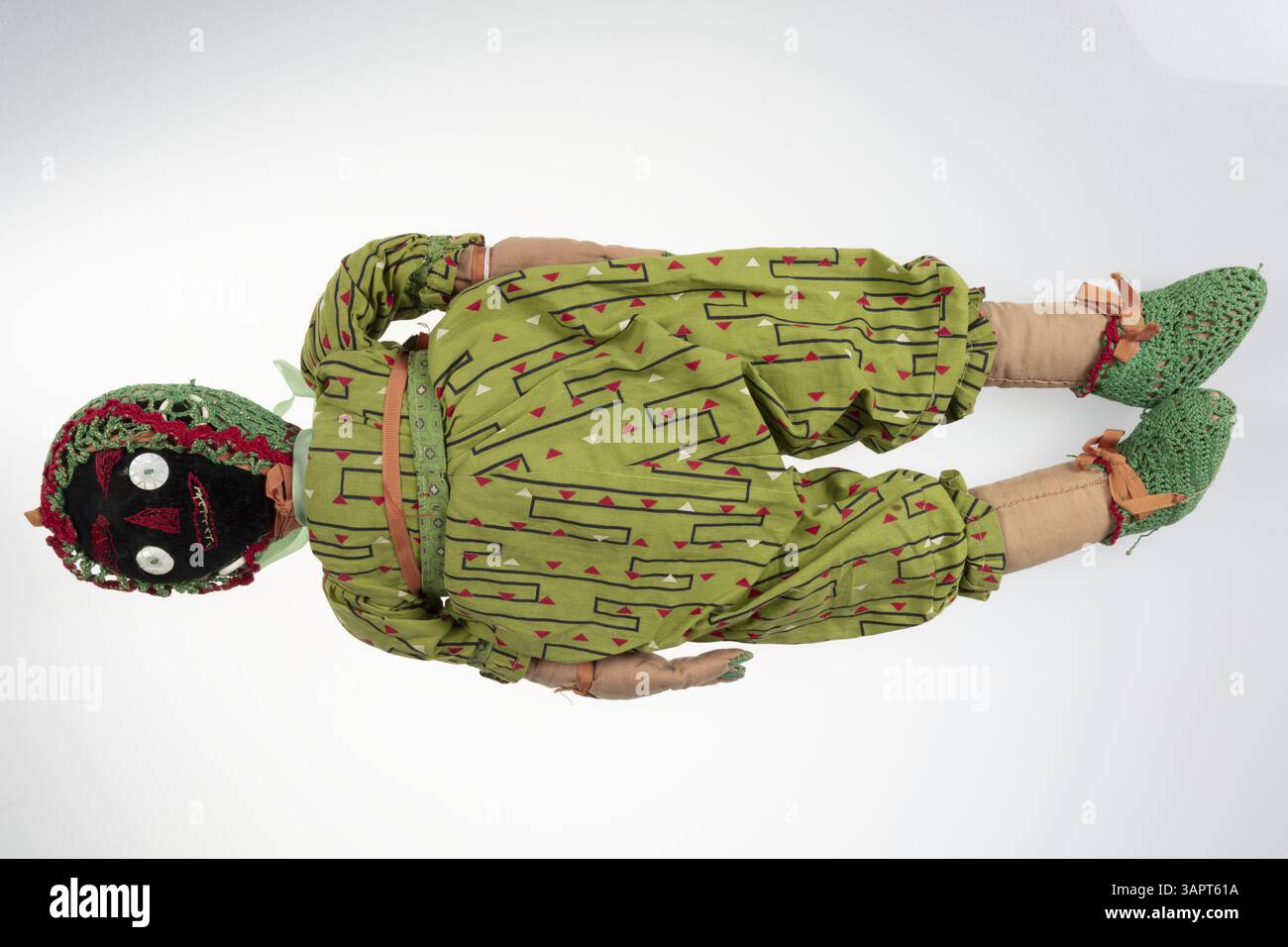 'Bessie' is a hand-sewn doll with a black face and green dress, crafted ...