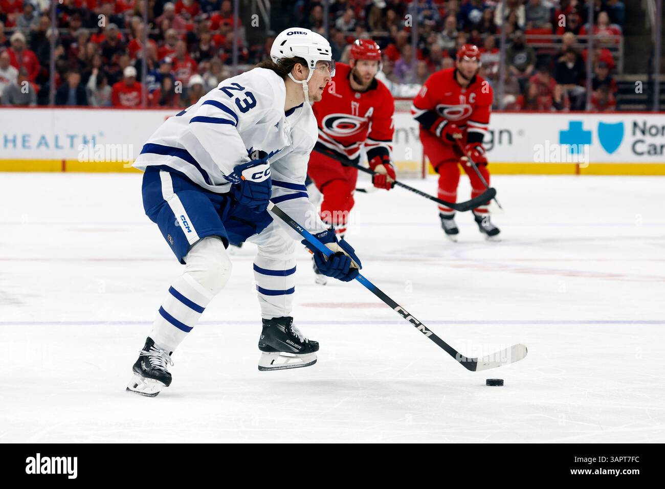 Toronto Maple Leafs' Matthew Knies (23) skates with the puck against ...