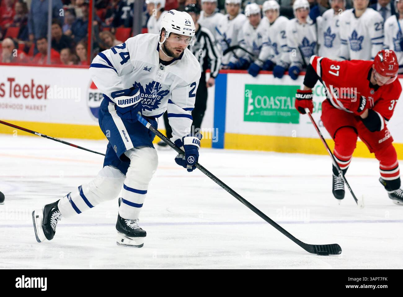 Toronto Maple Leafs' Scott Laughton (24) skates with the puck against ...