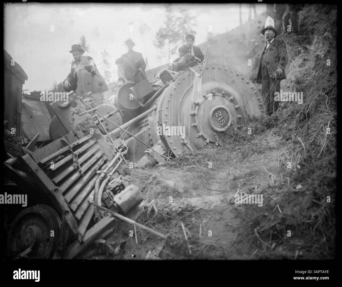 This photo shows the wreck of engine no. 215 on the O.R.N. railroad ...