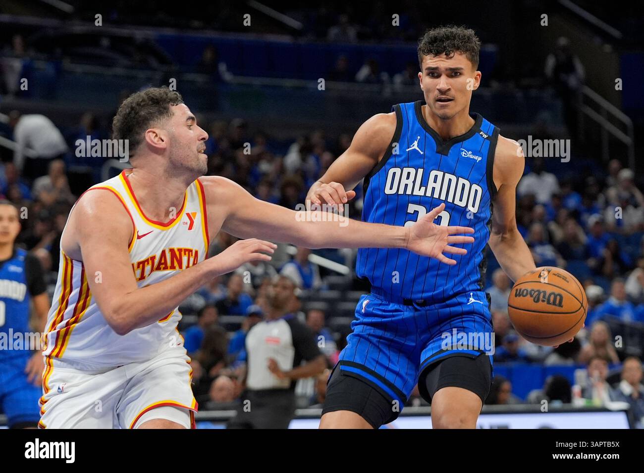 Orlando Magic forward Tristan da Silva, right, looks to get around ...
