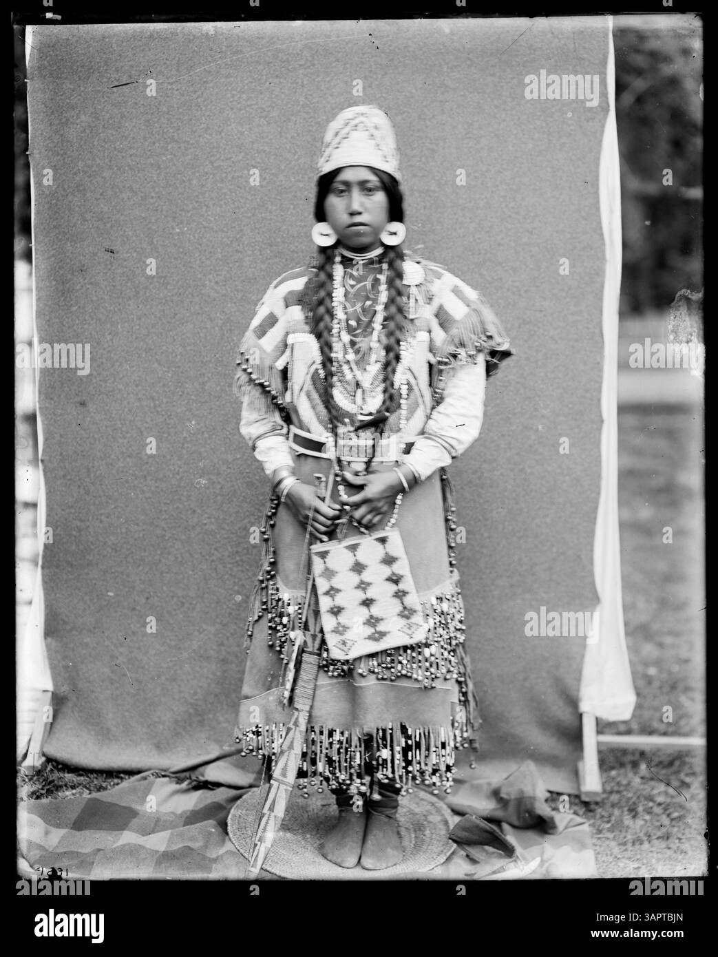 The photograph portrays Sally Chapman, a Native American woman, dressed ...