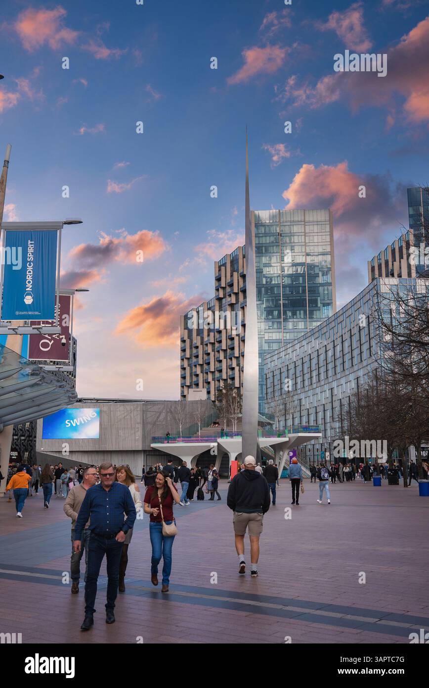 Bustling London plaza featuring the Spire of Hope sculpture, modern ...