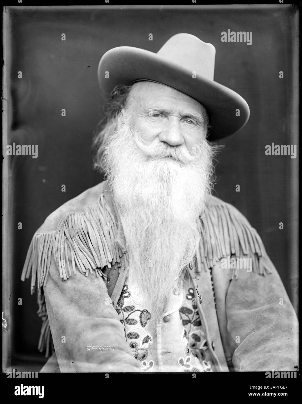 This photograph shows Joaquin Miller in frontier costume, holding a ...