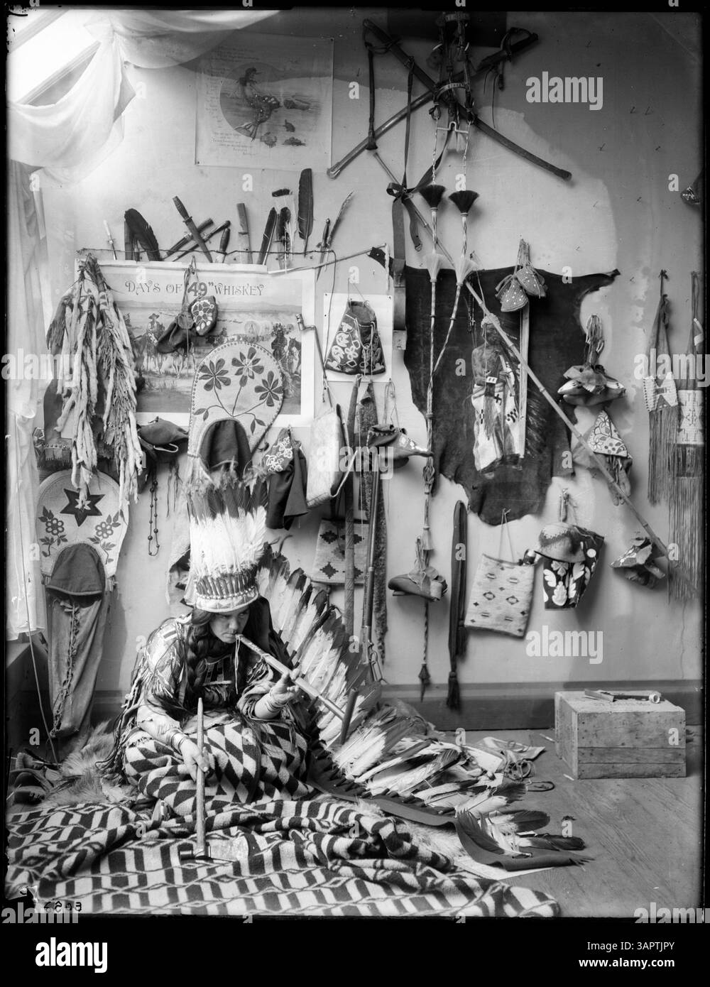 Photograph by Lee Moorhouse of a collection of Native American regalias ...
