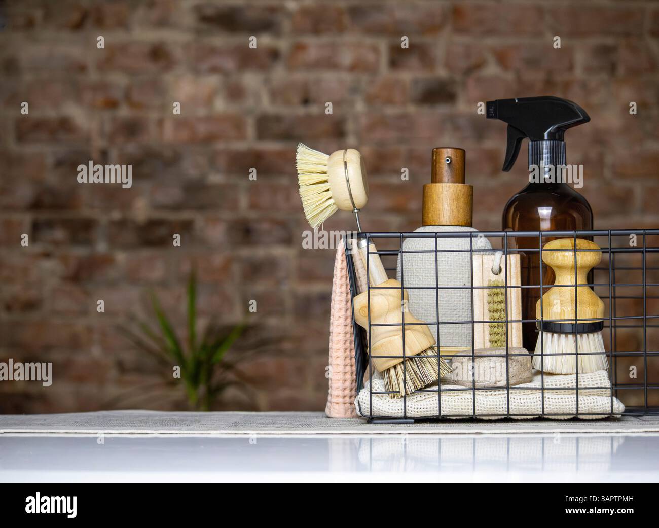 Eco-friendly Cleaning Tools in Black Modern Wire Basket Stock Photo - Alamy