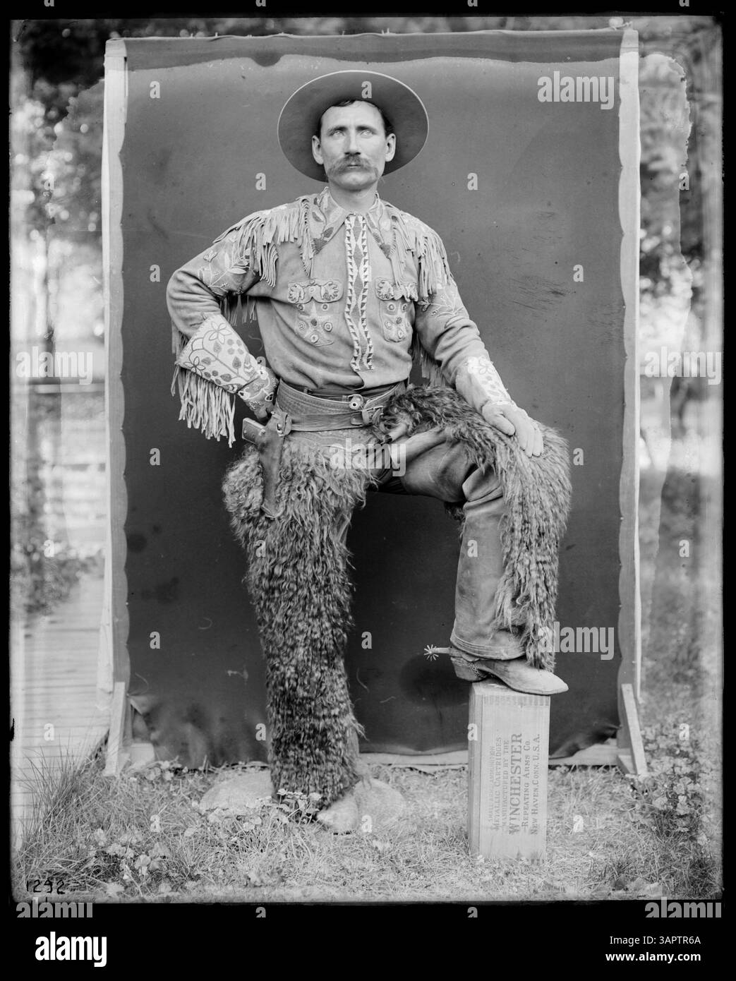 Full-length portrait of Munshang, a cowboy, captured in a traditional ...