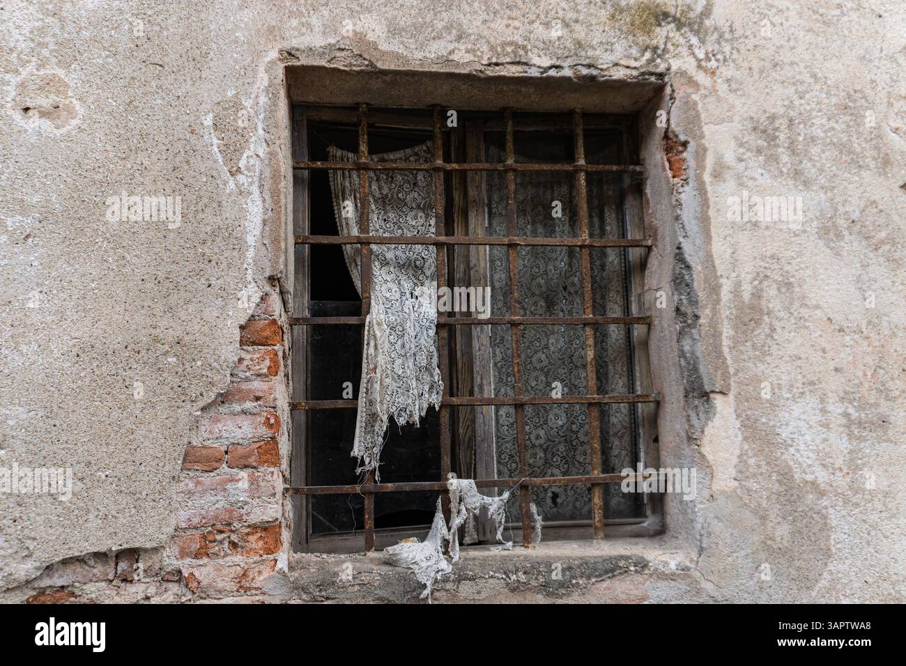 Abandoned house interior, gloomy scary window with ghostly light and shadows in a dark black ...