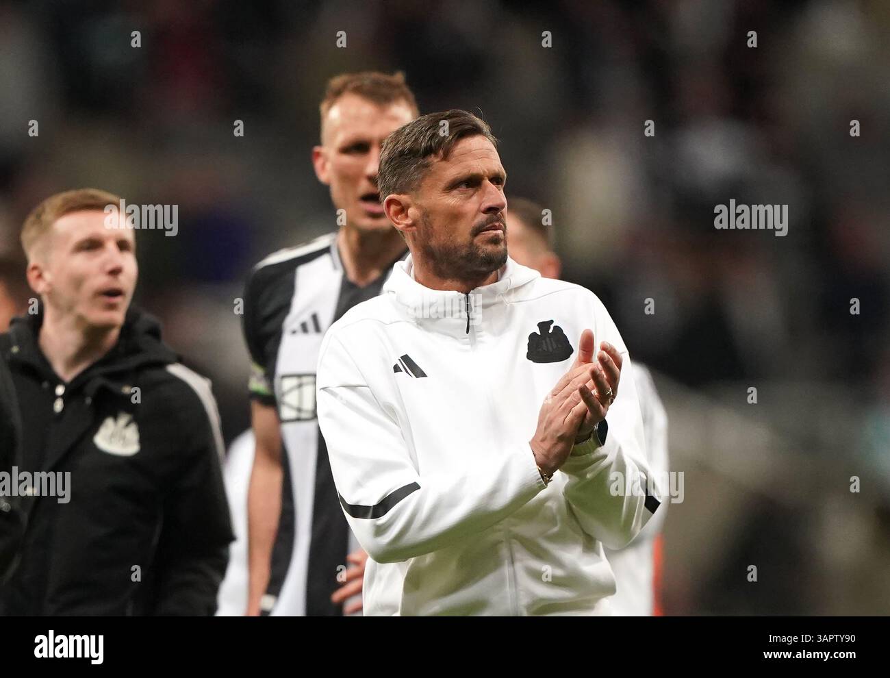 Newcastle United assistant manager Jason Tindall applauds the fans ...
