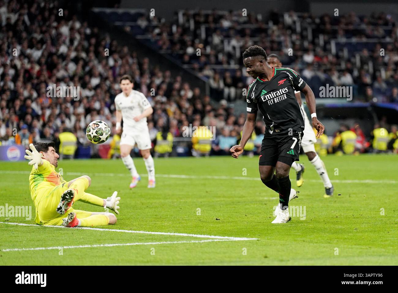 Arsenal's Bukayo Saka scores their side's first goal of the game during ...