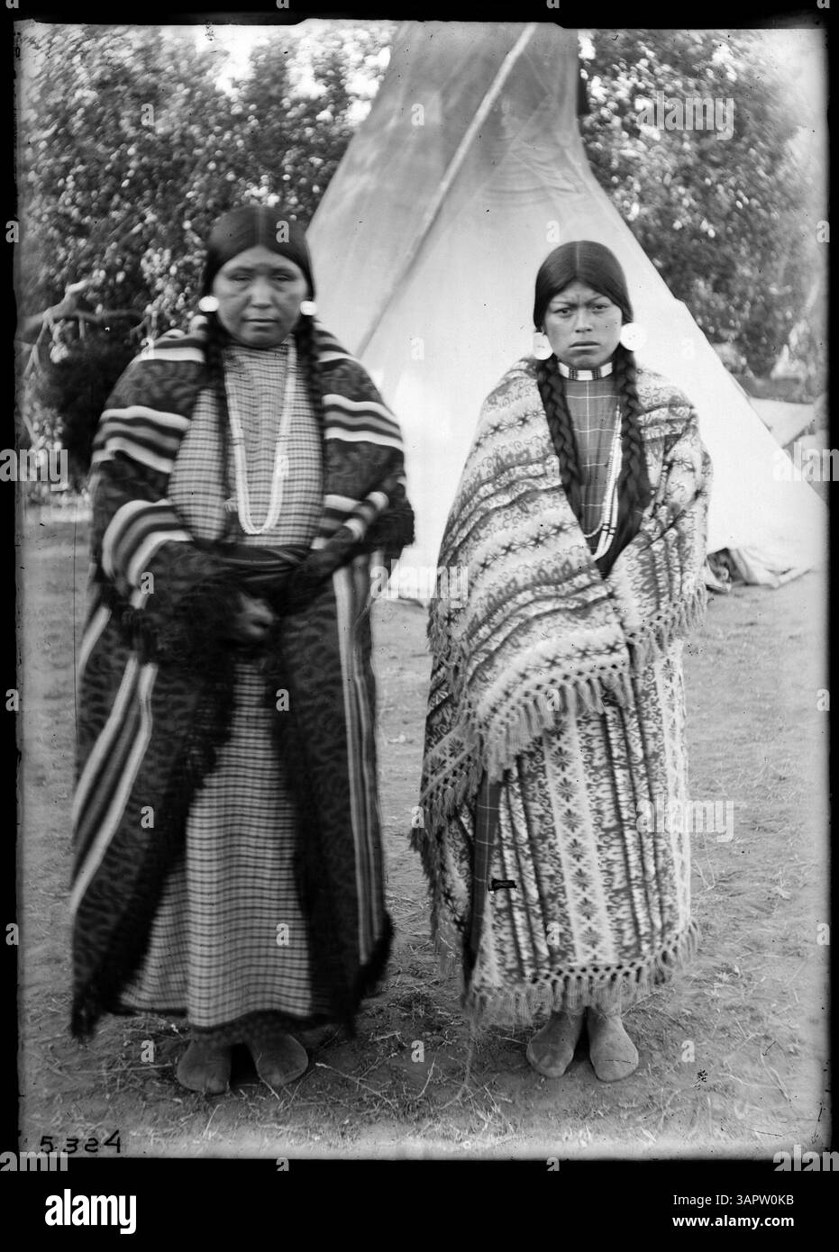 This photograph features tribal women in various regalia, representing indigenous cultural ...