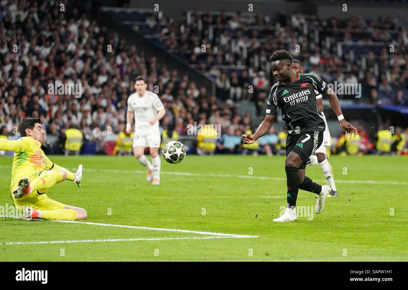 Arsenal's Bukayo Saka scores their side's first goal of the game during ...
